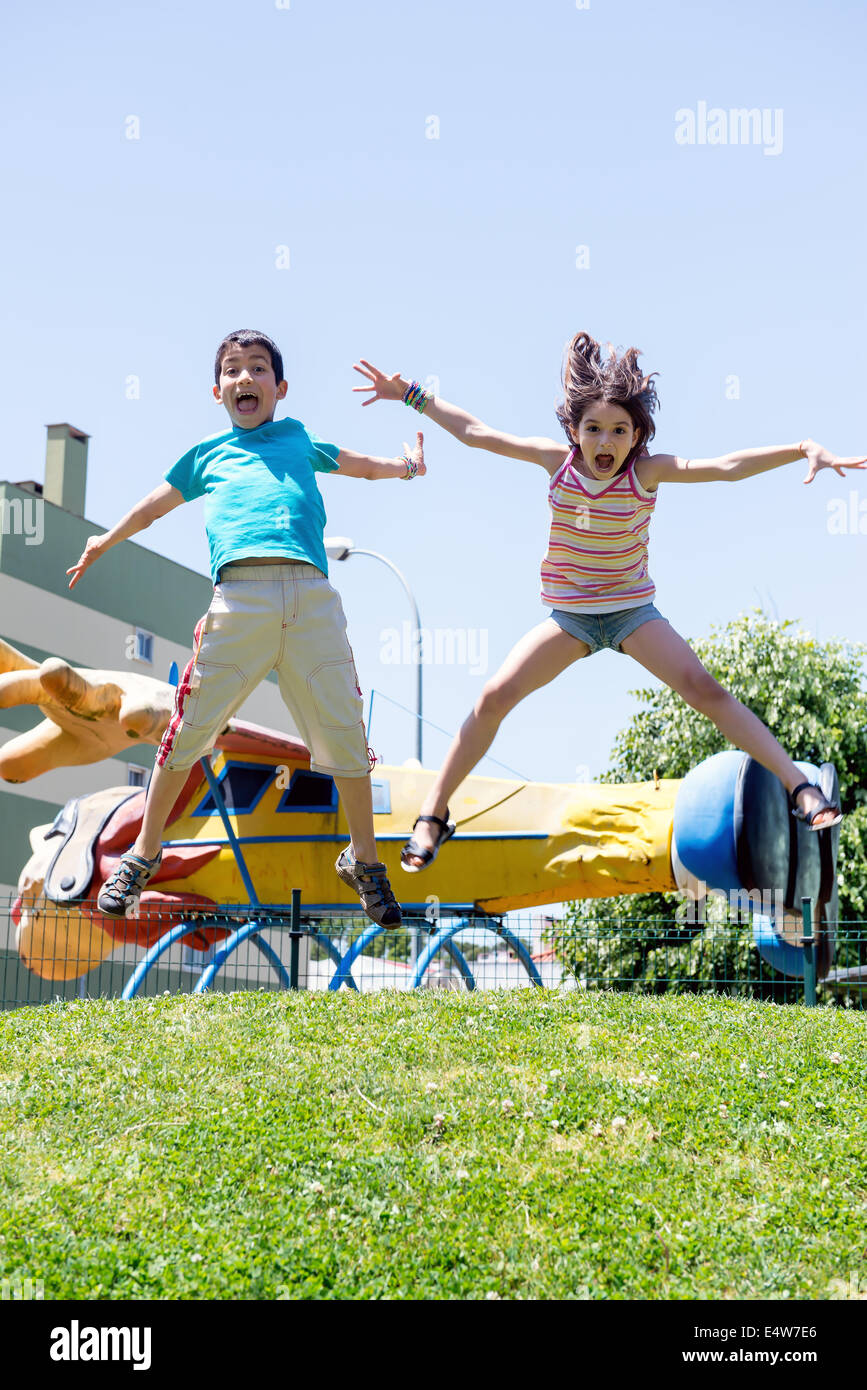 Young kids having fun in the park Stock Photo - Alamy