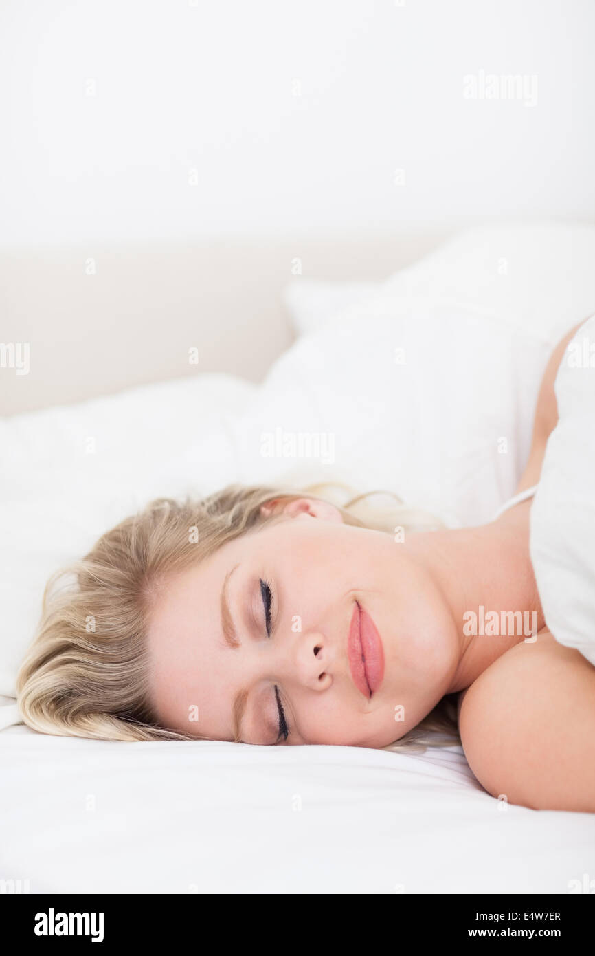 Woman sleeping with a smile Stock Photo - Alamy