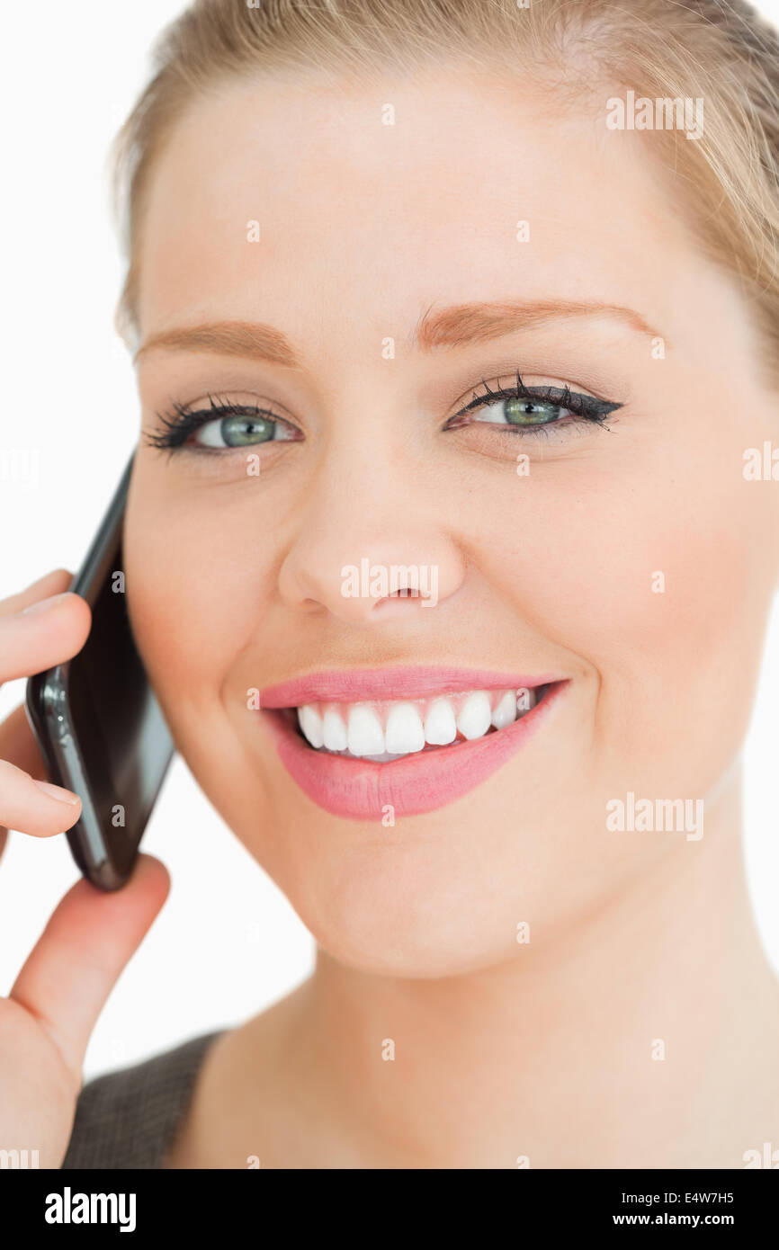 Woman smiling calling with her smartphone Stock Photo - Alamy