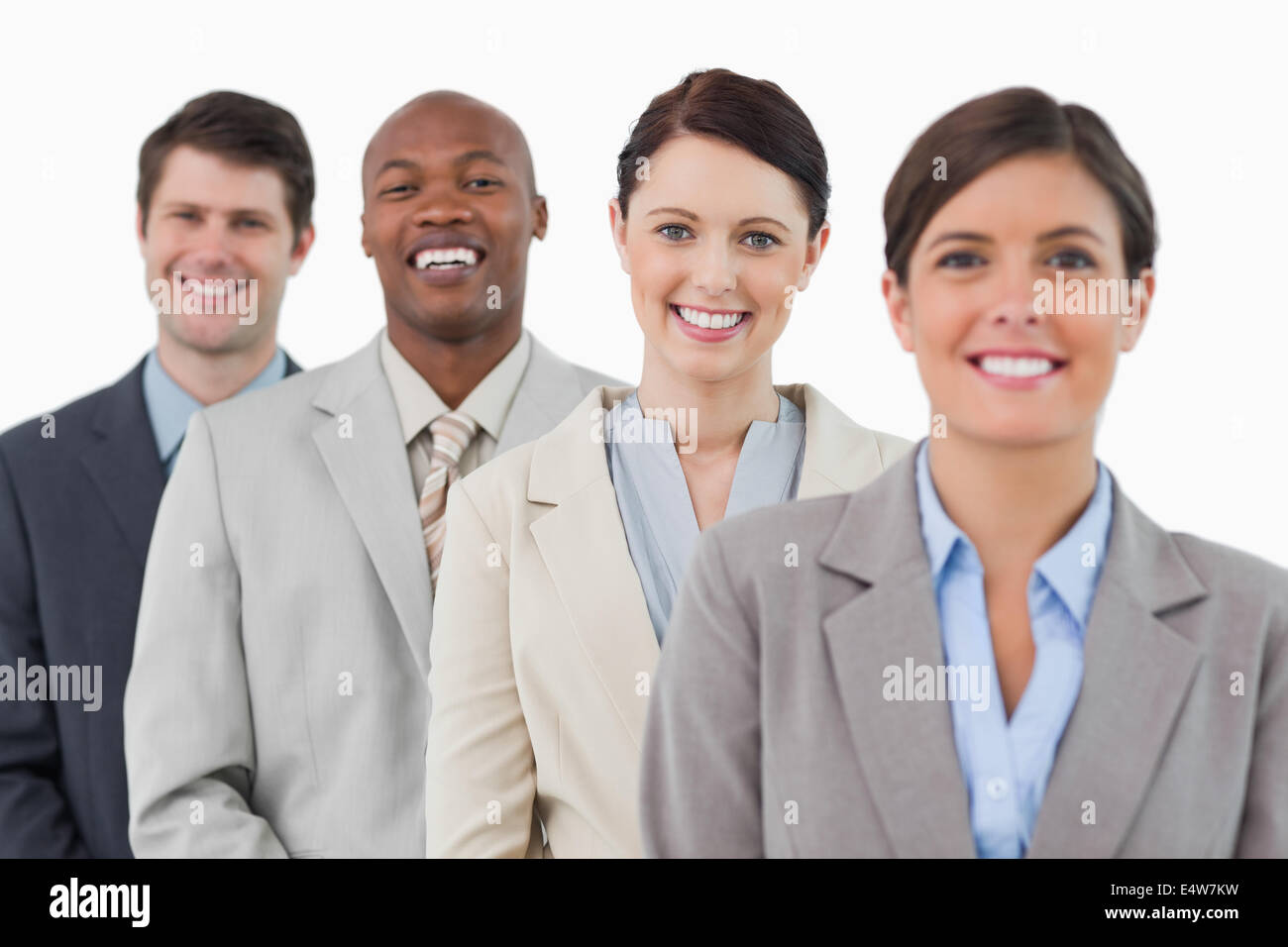 Smiling young tradesteam standing together Stock Photo - Alamy