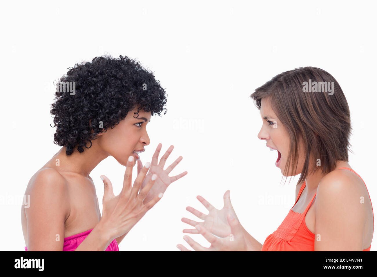Teenagers standing upright while shouting Stock Photo - Alamy