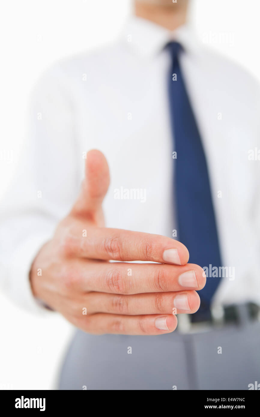 Close-up of a man in a suit giving a hand Stock Photo - Alamy