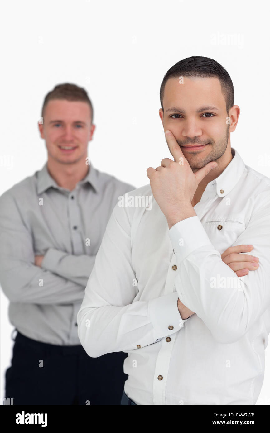 Two men crossing their arms Stock Photo - Alamy
