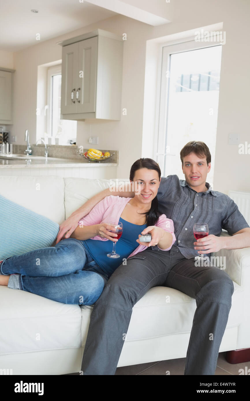 Young relaxing couple in the living room Stock Photo - Alamy
