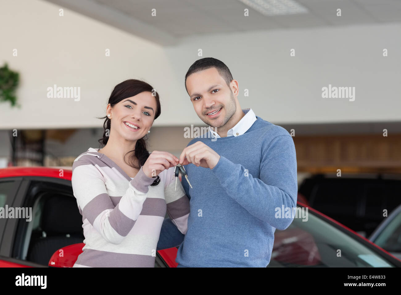 Woman standing next to a car hi-res stock photography and images - Alamy