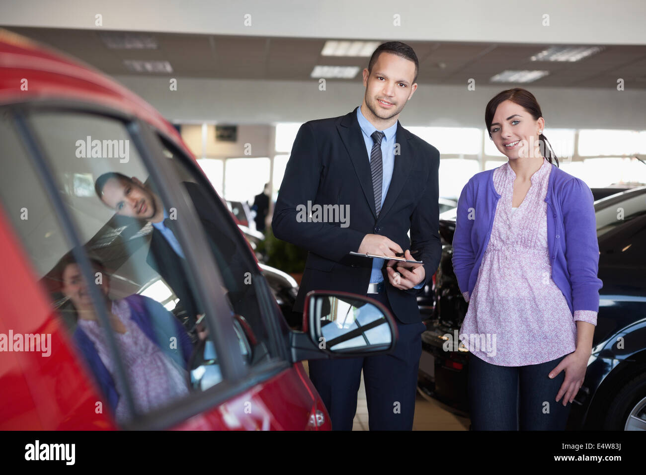 Woman salesman standing side hi-res stock photography and images - Alamy