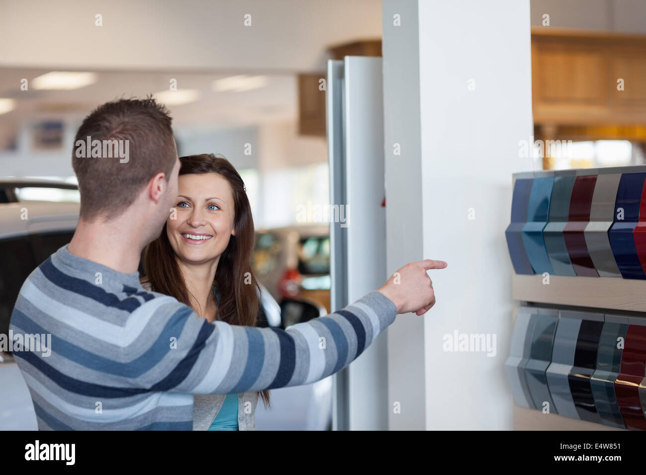 Customers choosing a colour Stock Photo - Alamy