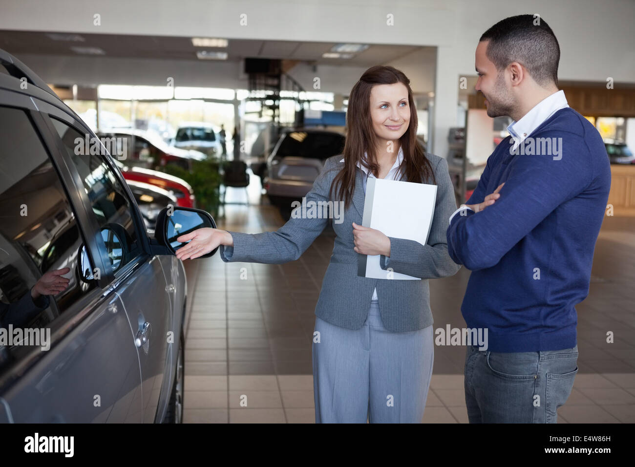 Car dealer presenting vehicle hi-res stock photography and images - Alamy