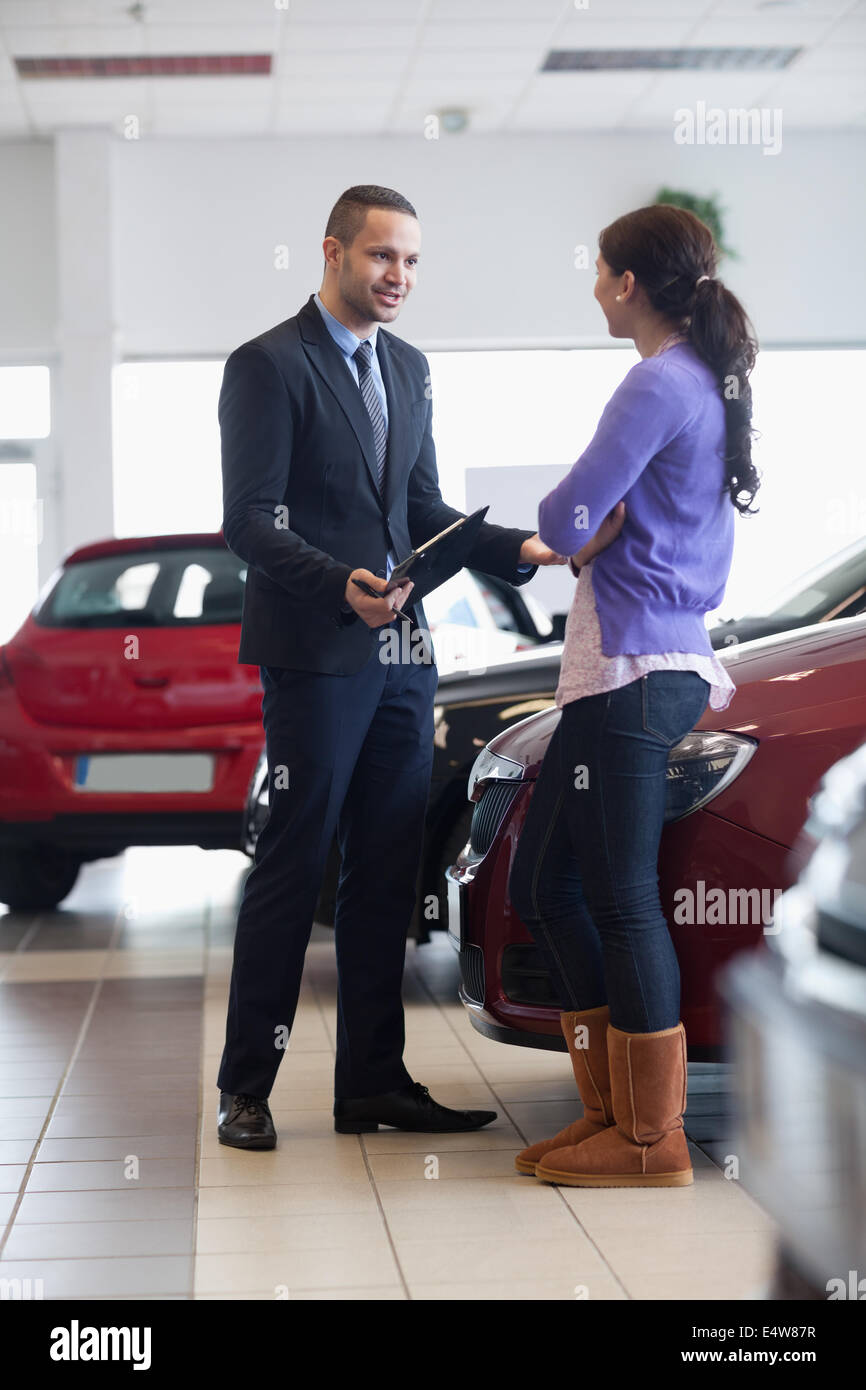 Salesman talking to a customer Stock Photo - Alamy