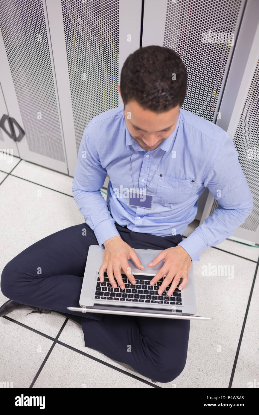 Man using his laptop in data center Stock Photo - Alamy