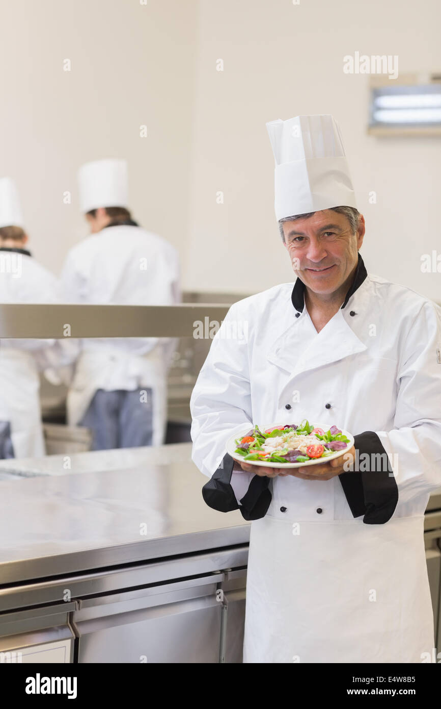 Chef showing his salad in the kitchen Stock Photo - Alamy