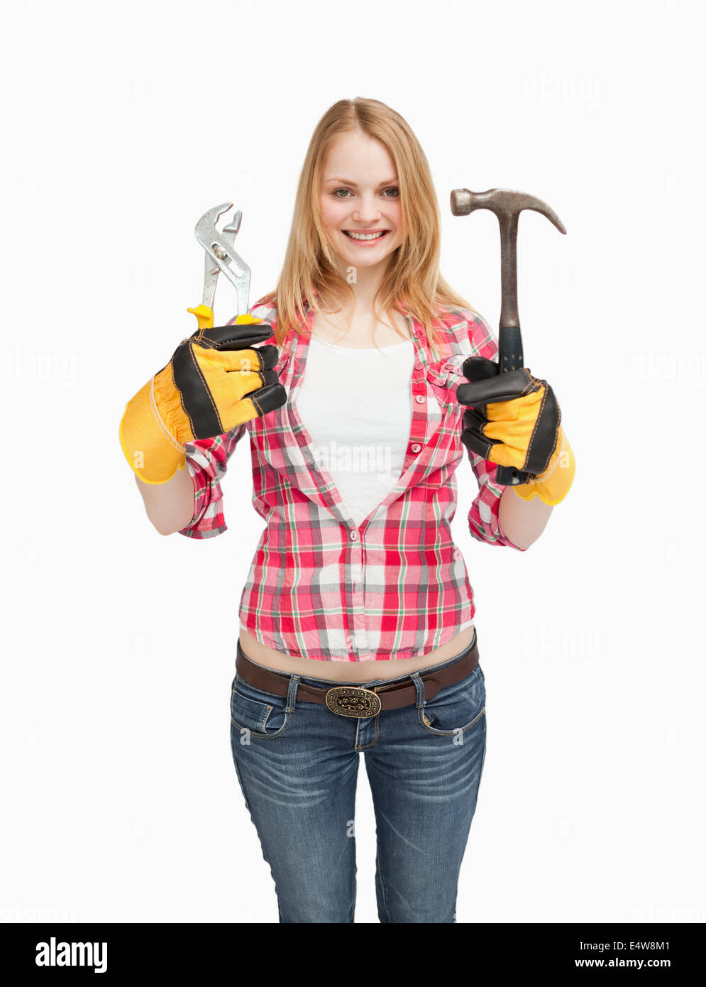 Cheerful woman holding tools Stock Photo - Alamy