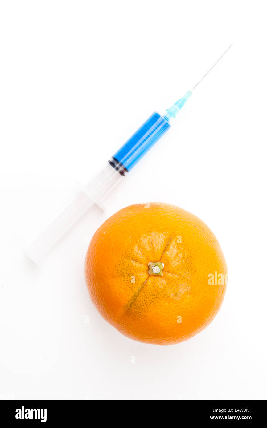 Syringe injecting orange fruit hi-res stock photography and images - Alamy