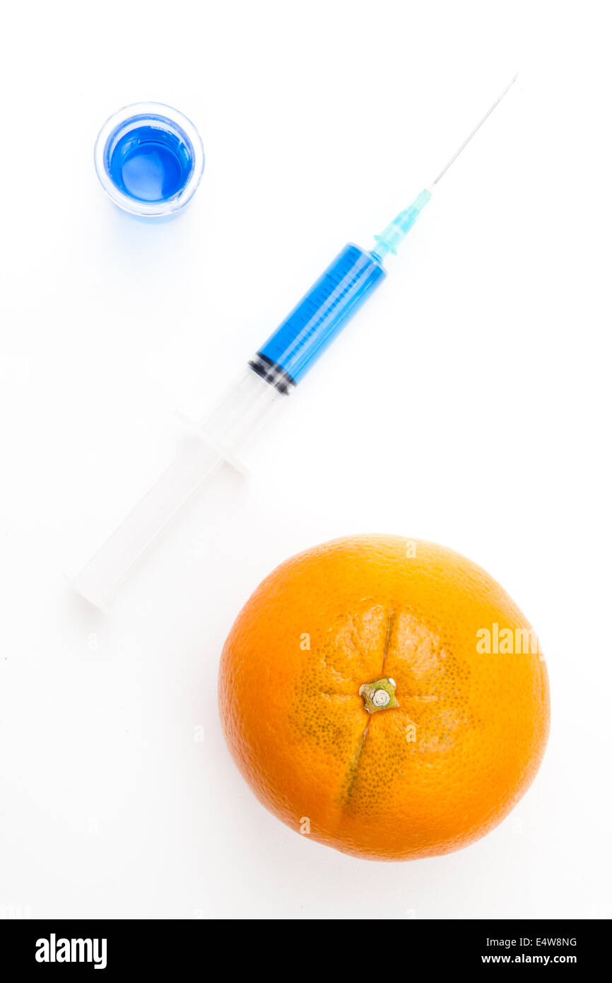 Syringe injecting orange fruit hi-res stock photography and images - Alamy