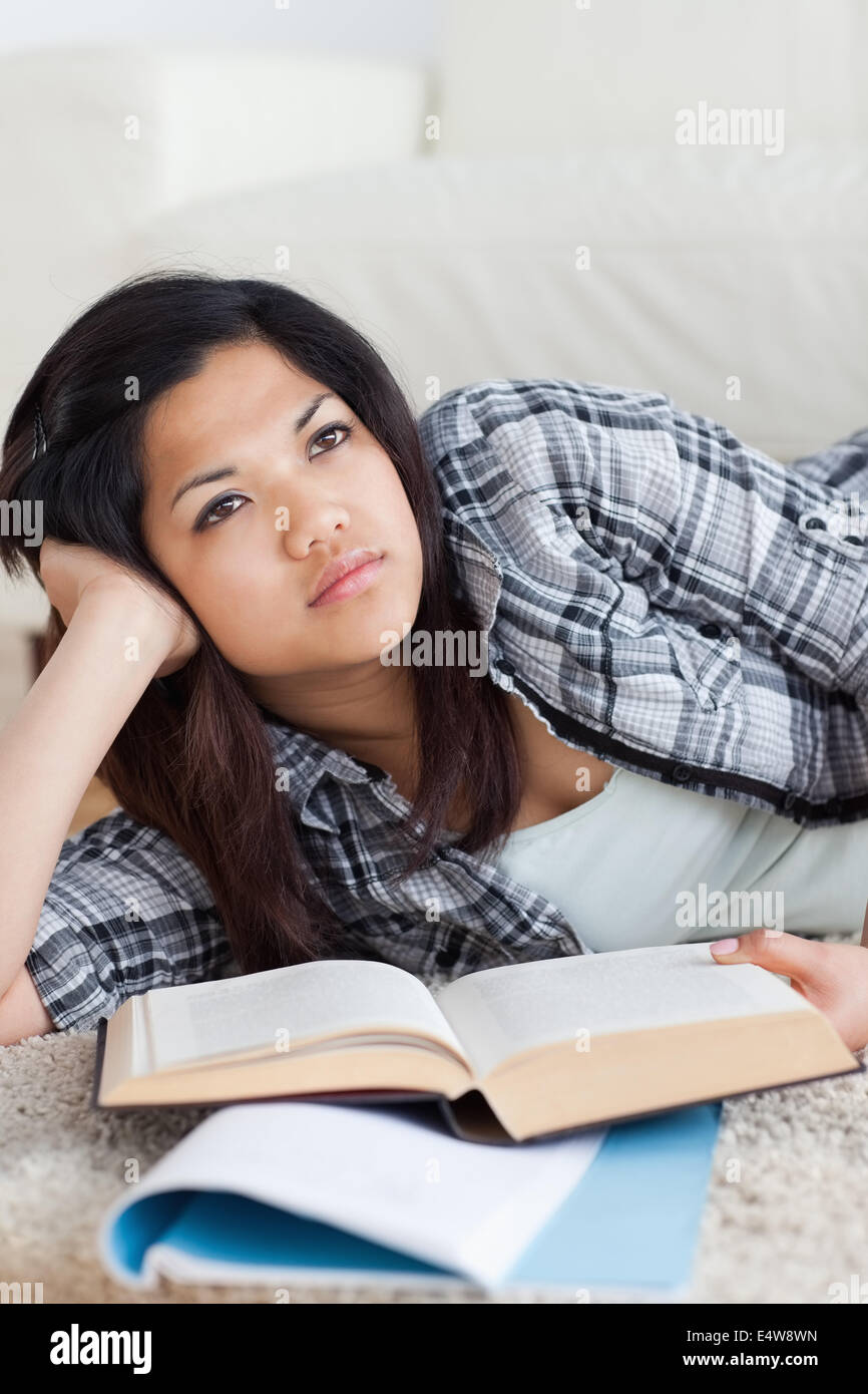 Woman holding pen reading book hi-res stock photography and images - Alamy