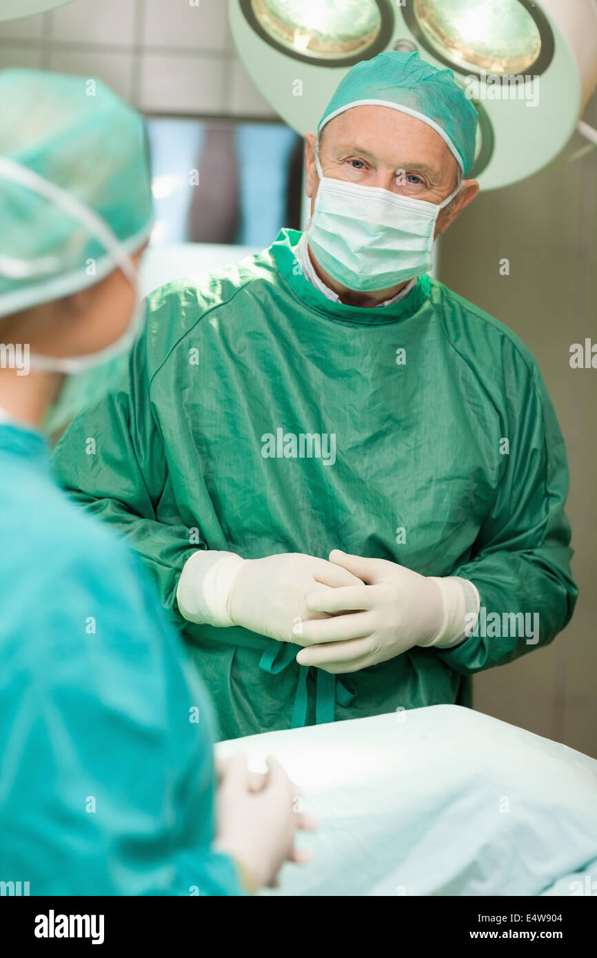 Two surgeons crossing their hands Stock Photo - Alamy