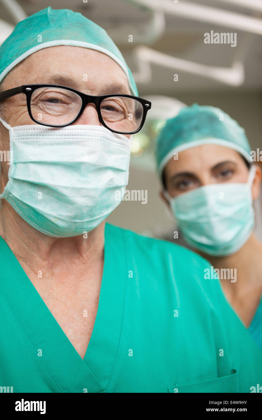 Man surgeon with glasses and a colleague Stock Photo - Alamy