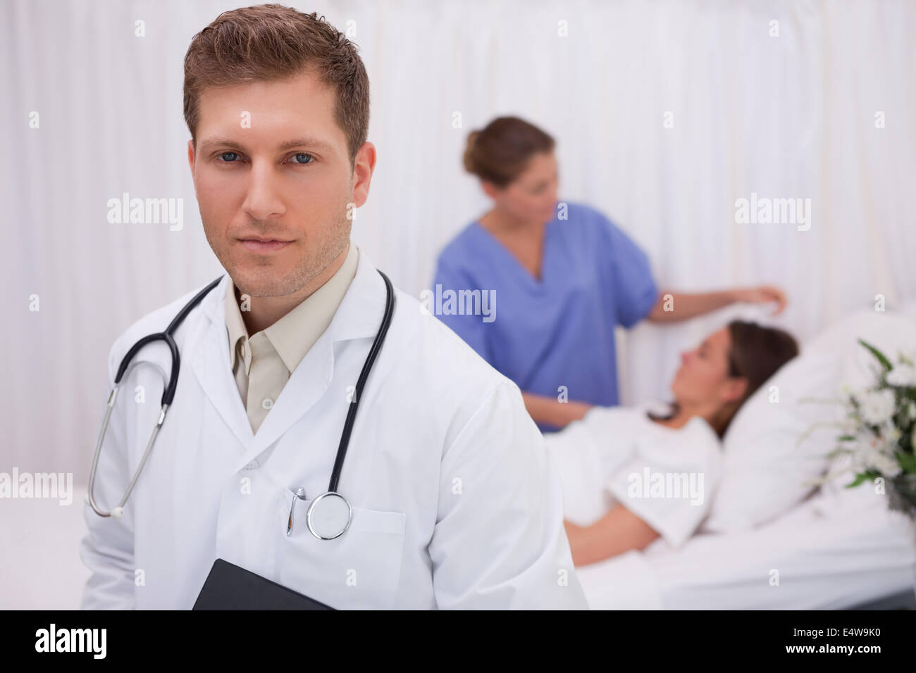 Doctor standing in his patients room Stock Photo - Alamy