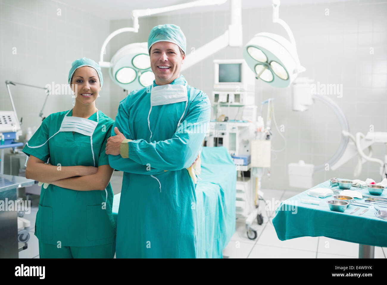 Surgeons standing up while smiling Stock Photo - Alamy