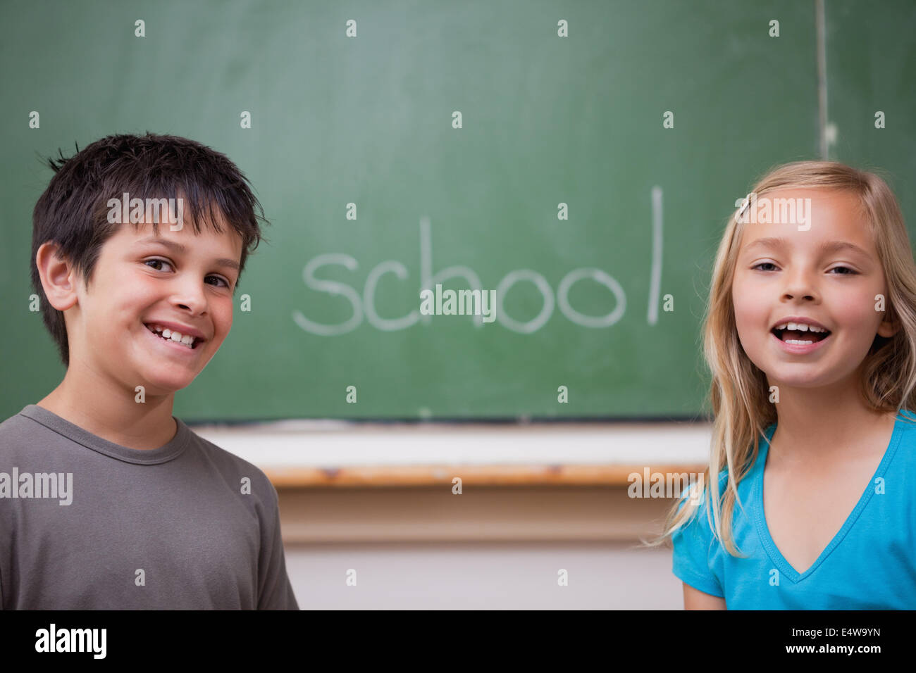 Happy pupils posing together Stock Photo - Alamy