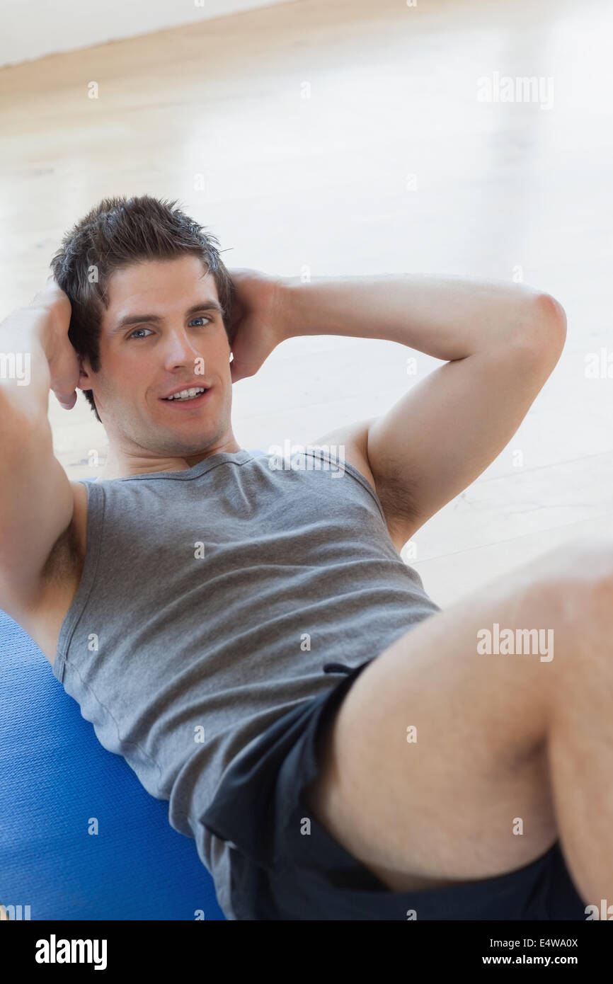 Man doing sit ups Stock Photo - Alamy