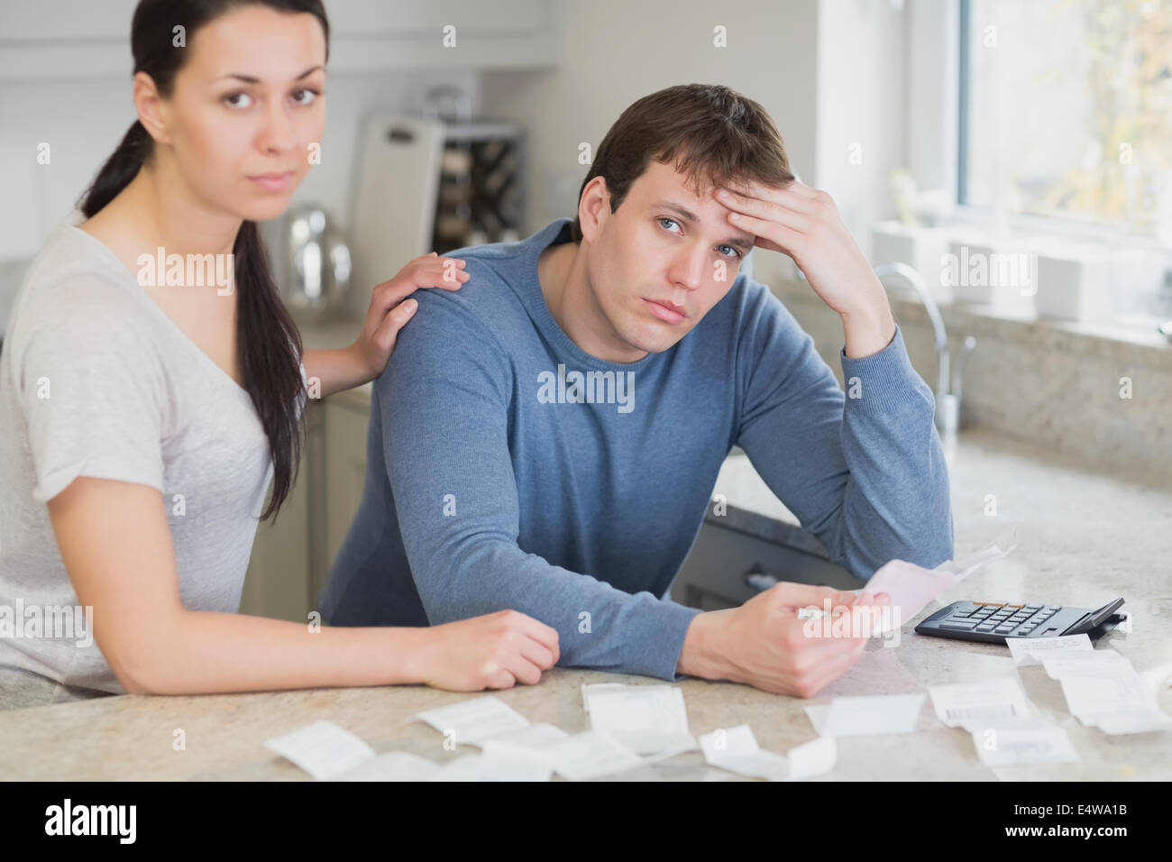 Couple getting stressed over bills Stock Photo - Alamy