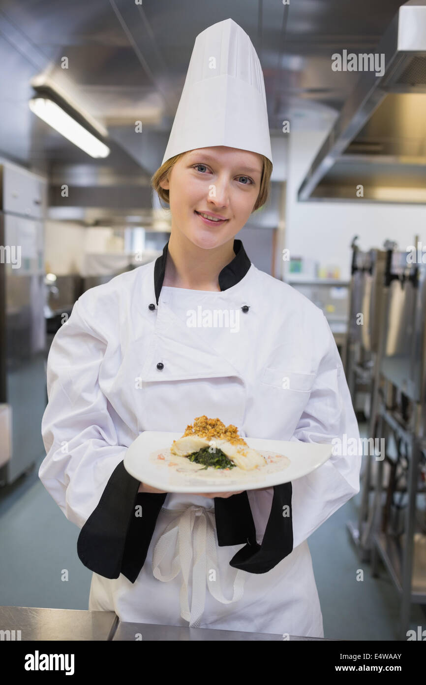 Smiling chef presenting dish Stock Photo - Alamy