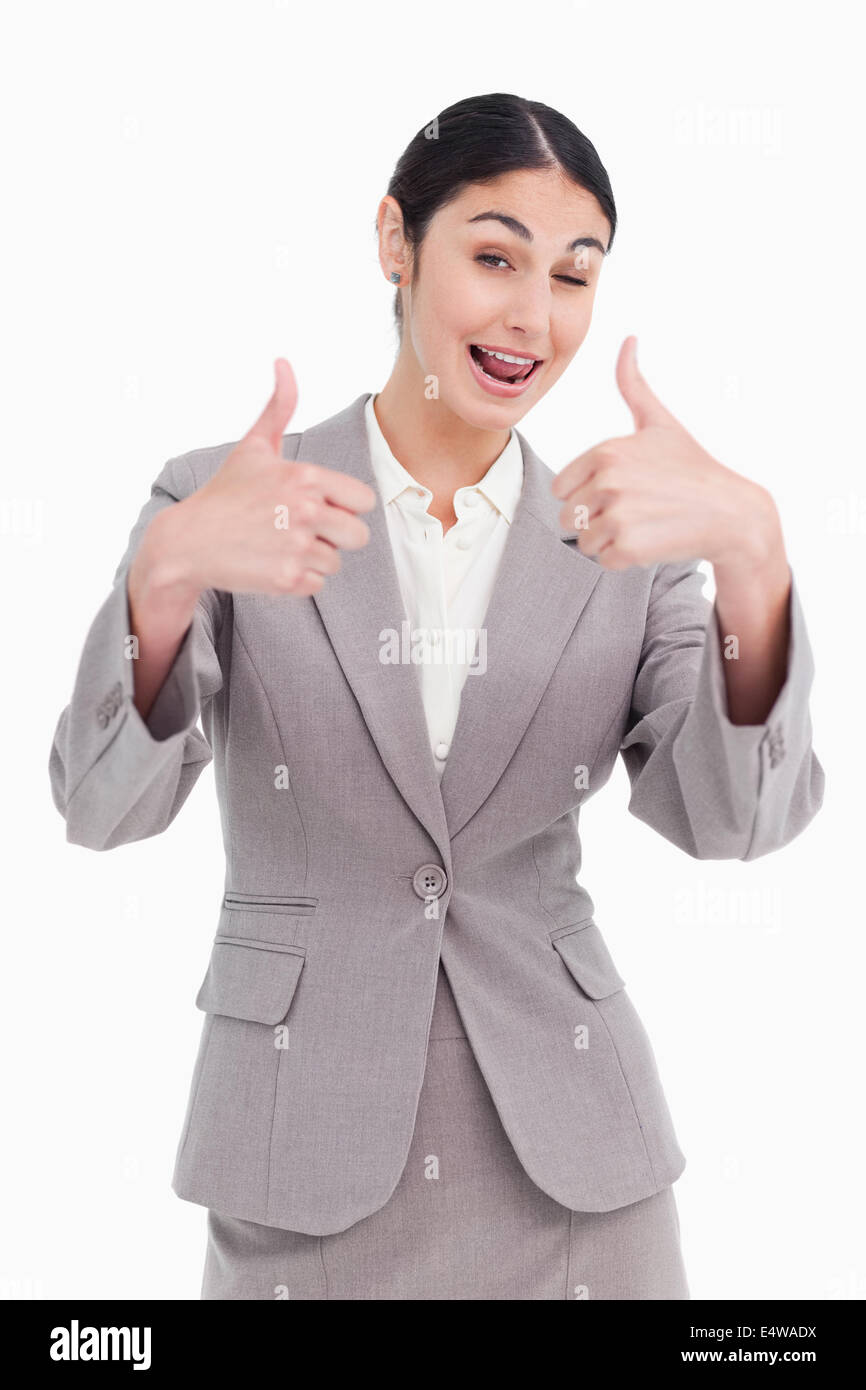 Cheering businesswoman giving thumbs up Stock Photo - Alamy