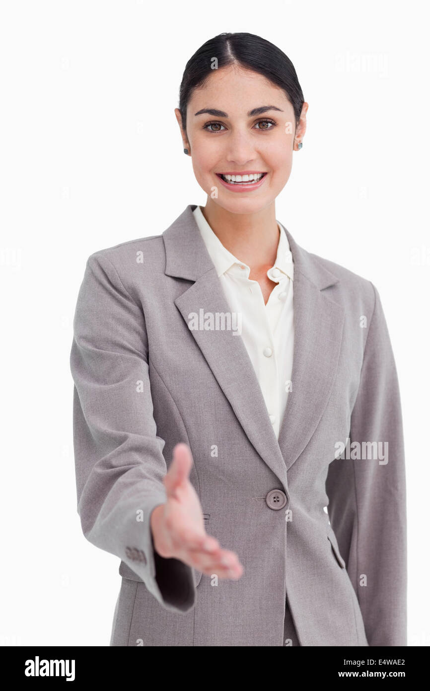 Smiling businesswoman offering her hand Stock Photo - Alamy