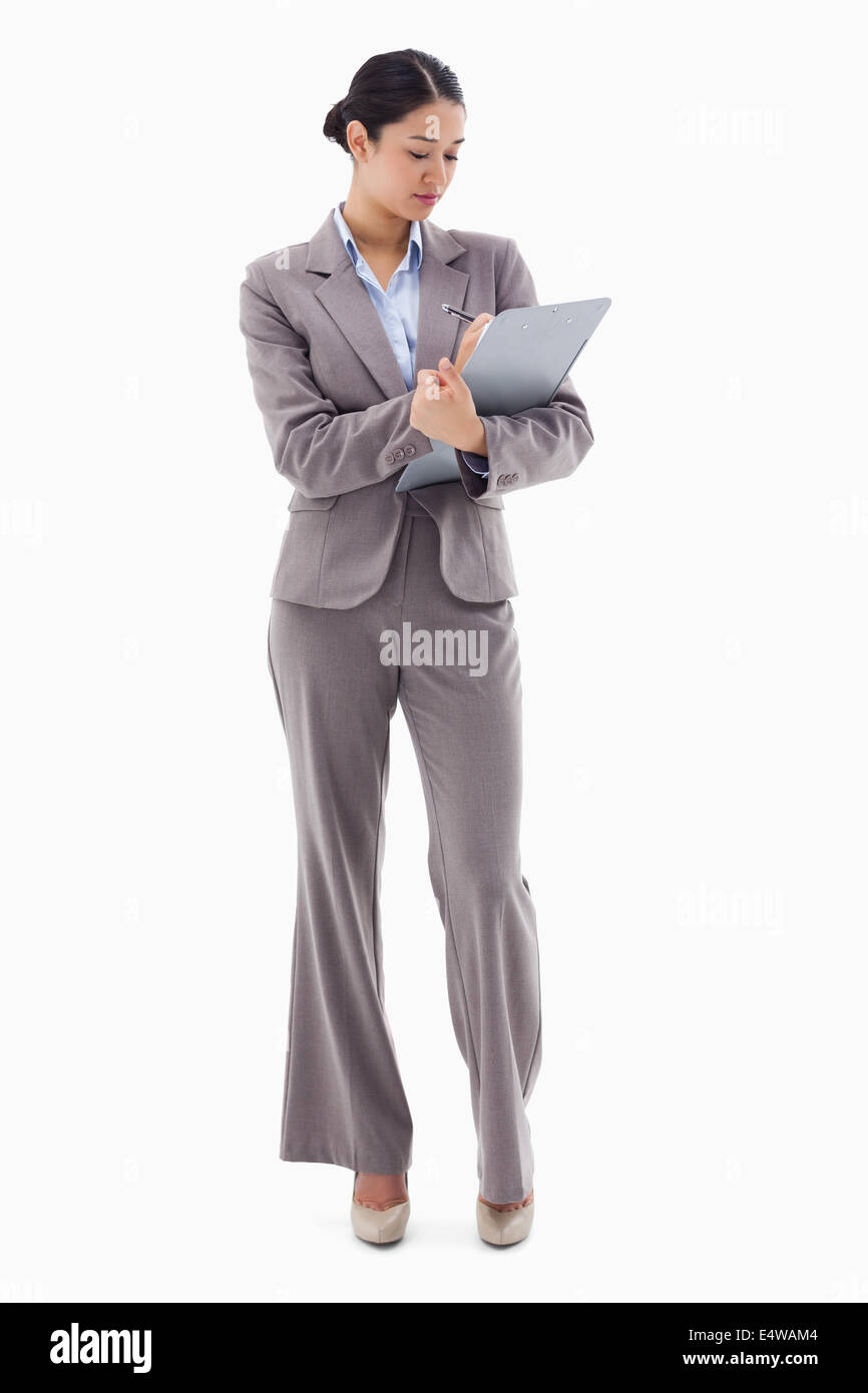 Portrait of a businesswoman taking notes Stock Photo - Alamy