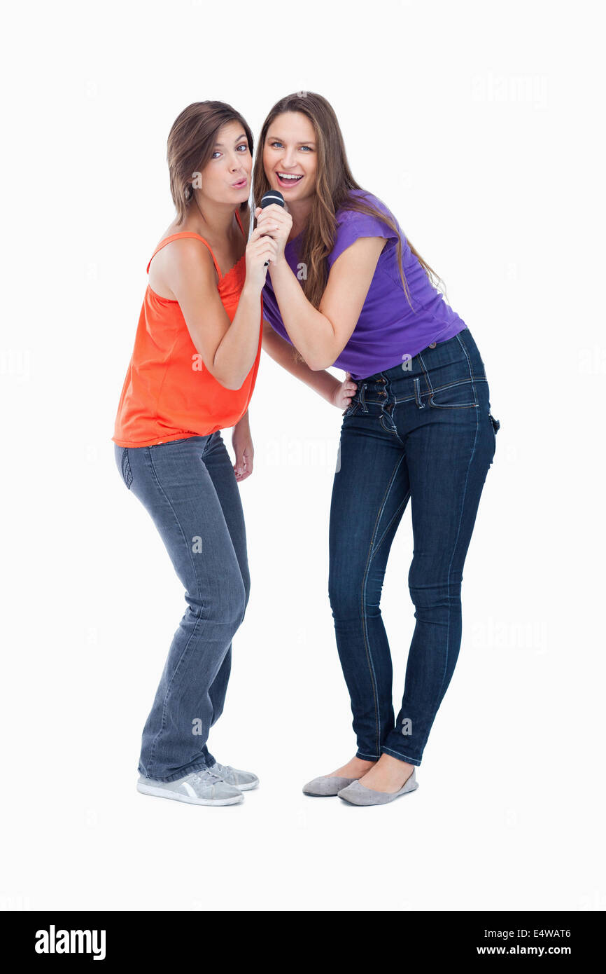 Two women singing Cut Out Stock Images & Pictures - Alamy
