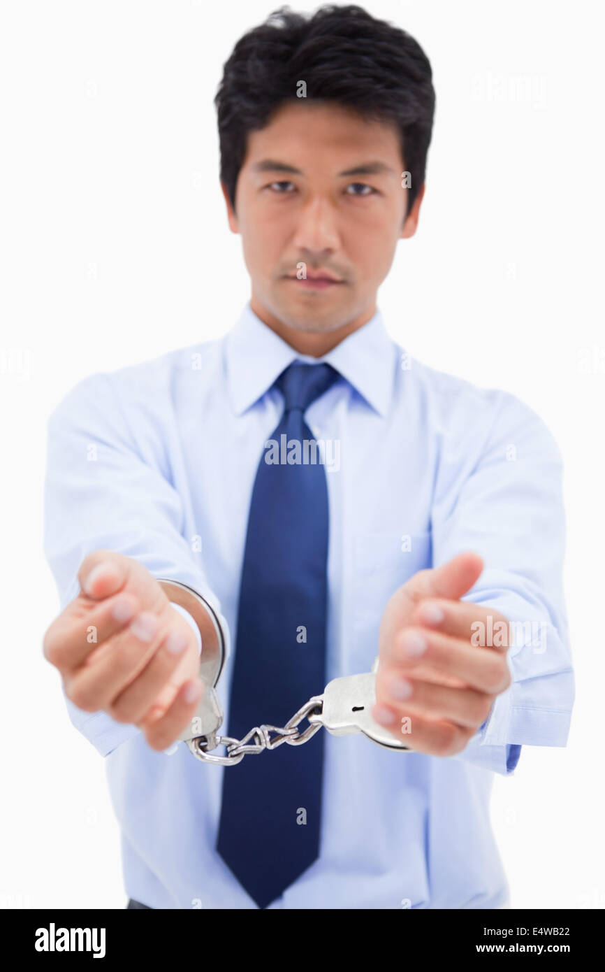 Portrait of a businessman with handcuffs Stock Photo - Alamy