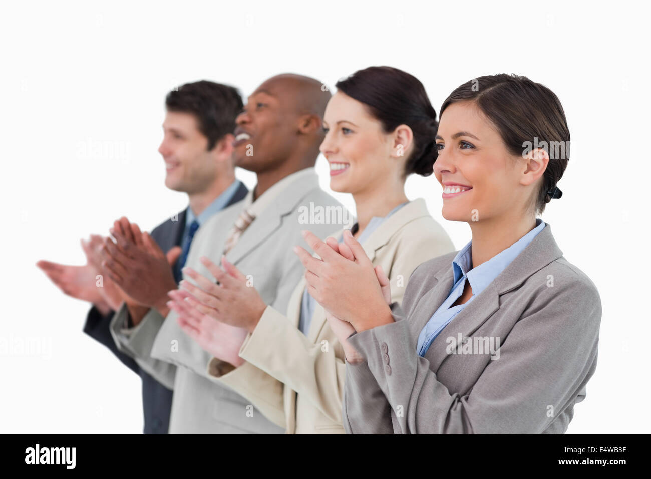Side view of applauding salesteam Stock Photo - Alamy