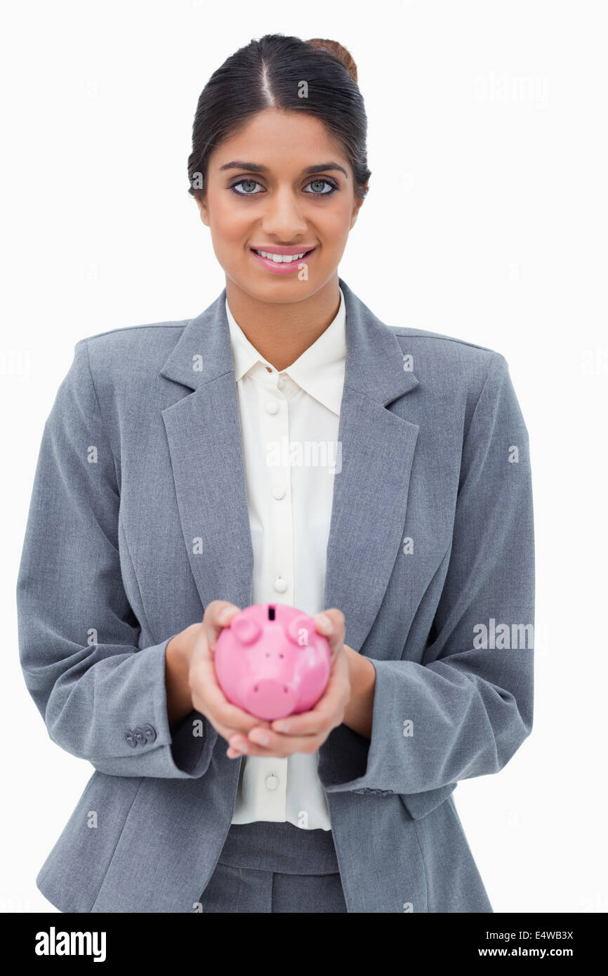 Smiling bank employee holding piggy bank Stock Photo - Alamy