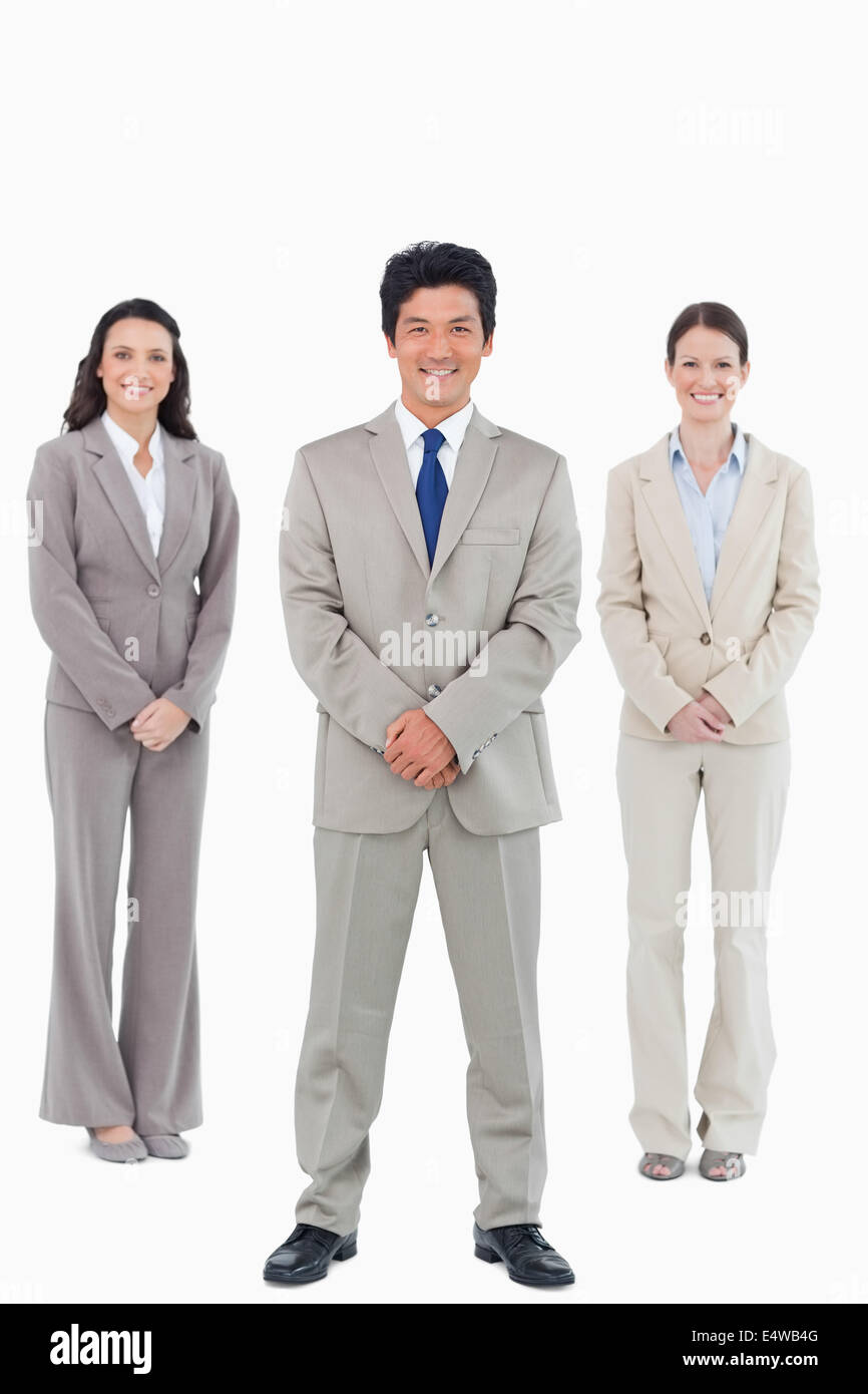 Smiling tradesteam standing Stock Photo - Alamy