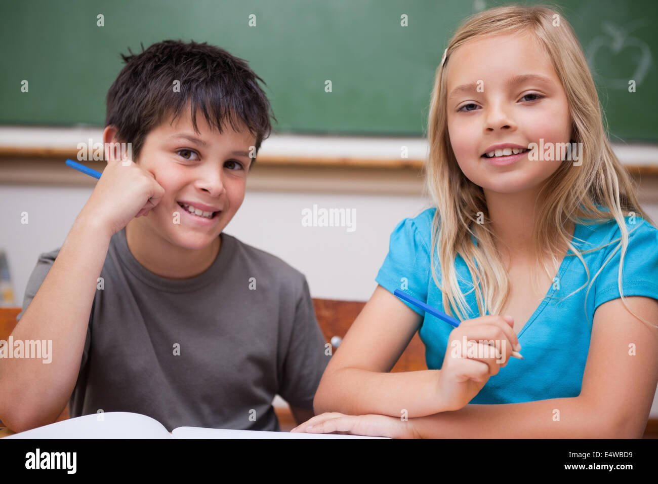 Smiling pupils working together Stock Photo - Alamy Smiling pupils working together Stock Photo - Alamy