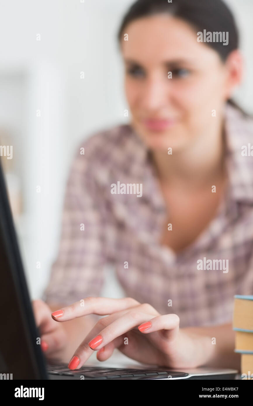 Woman typing on keyboard of laptop Stock Photo - Alamy