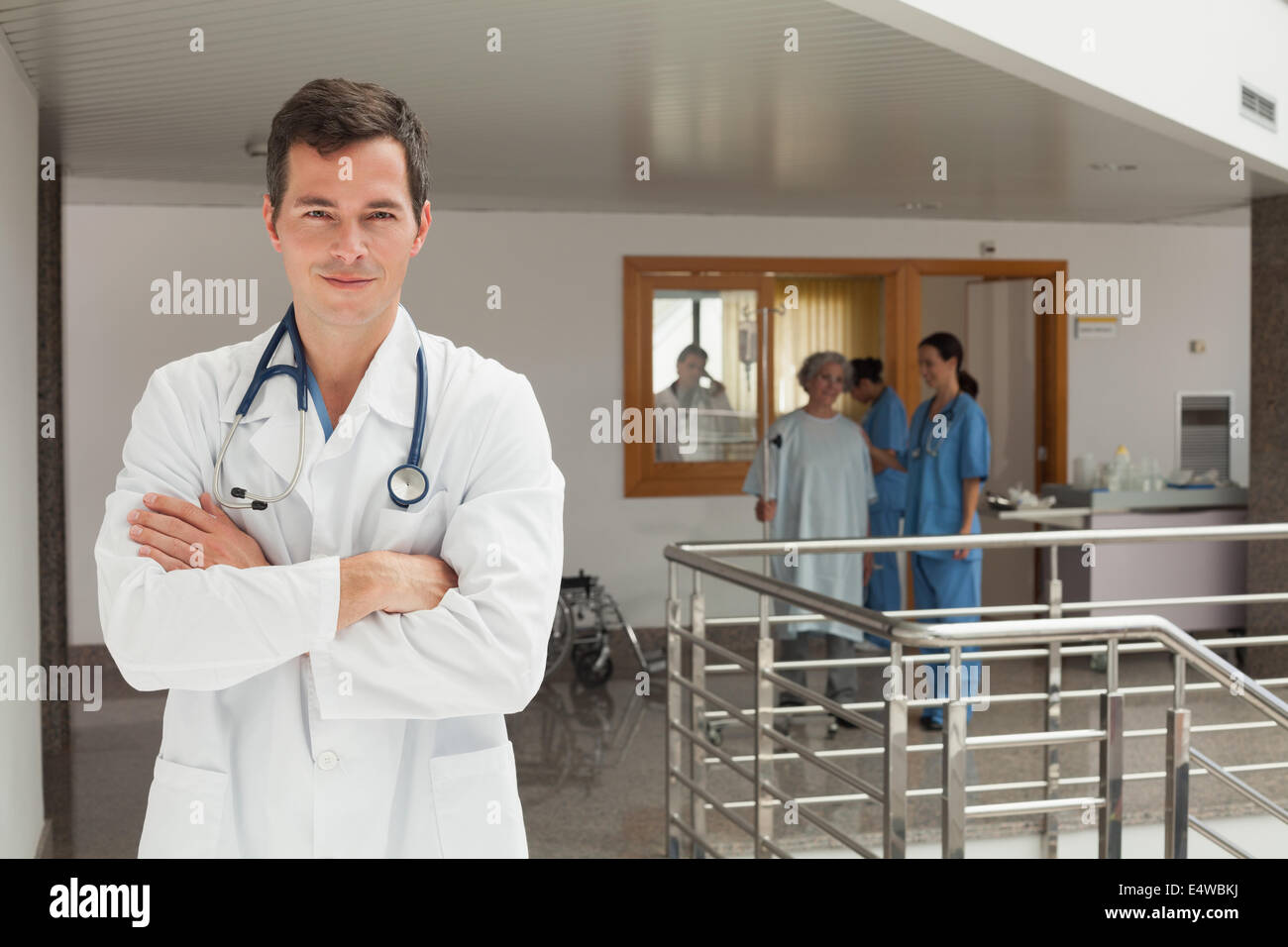 Standing female doctor crossing hi-res stock photography and images - Alamy