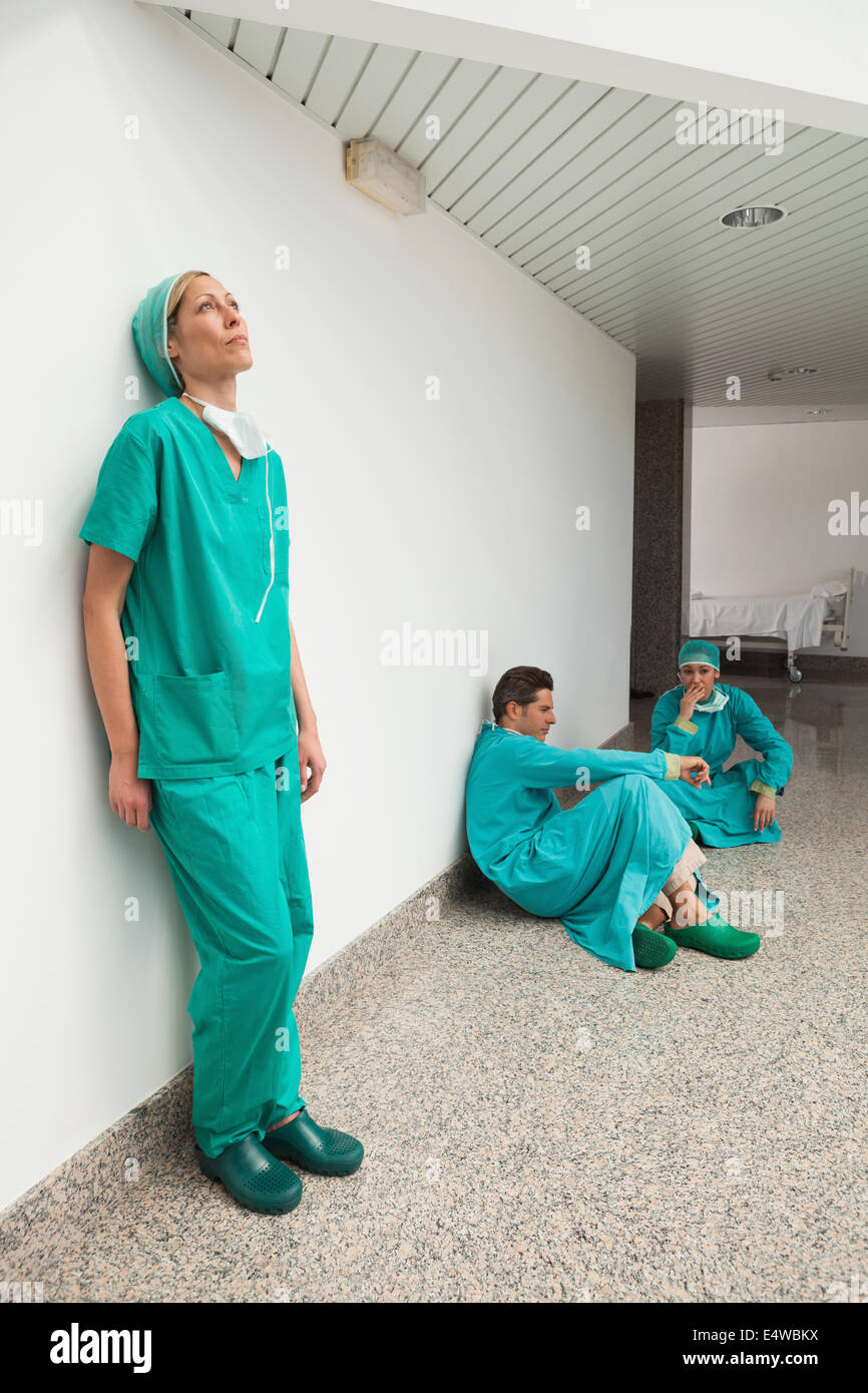 Three surgeons taking break Stock Photo - Alamy