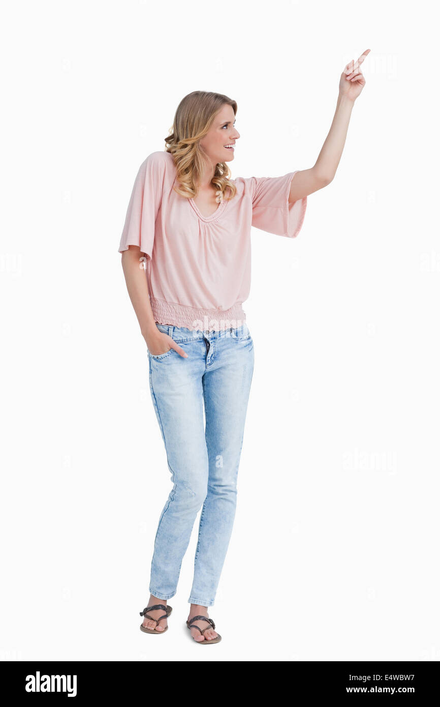 Smiling woman pointing her finger Stock Photo - Alamy