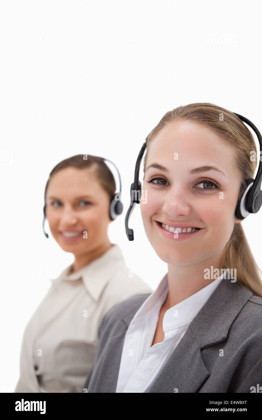 Portrait of young operators using headsets Stock Photo - Alamy