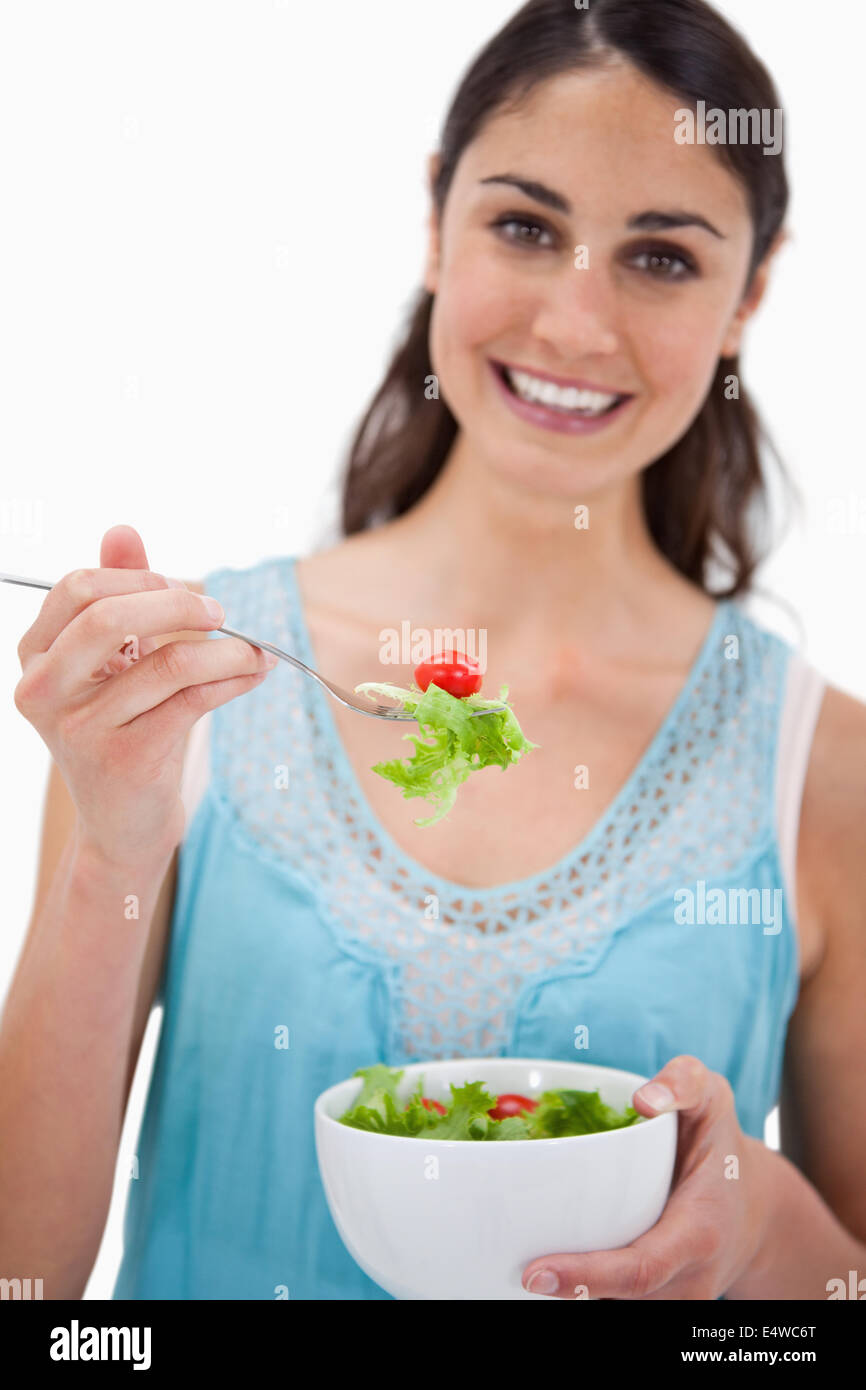 Portrait of a woman eating a salad Stock Photo - Alamy
