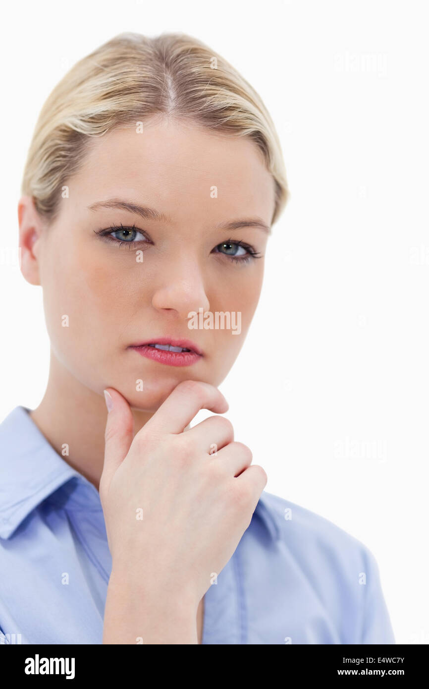 Thoughtful woman touching her chin Stock Photo - Alamy