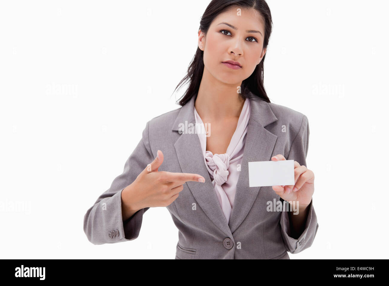 Businesswoman pointing at name badge Stock Photo - Alamy