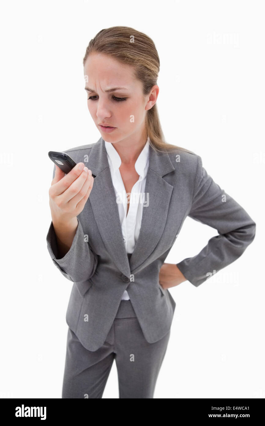 Irritated bank employee reading text message Stock Photo - Alamy