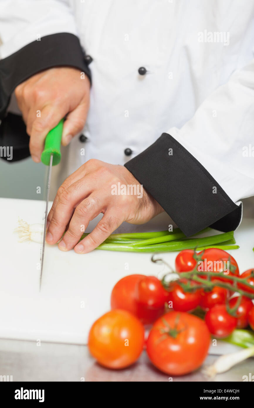 Chef slicing spring onions Stock Photo - Alamy