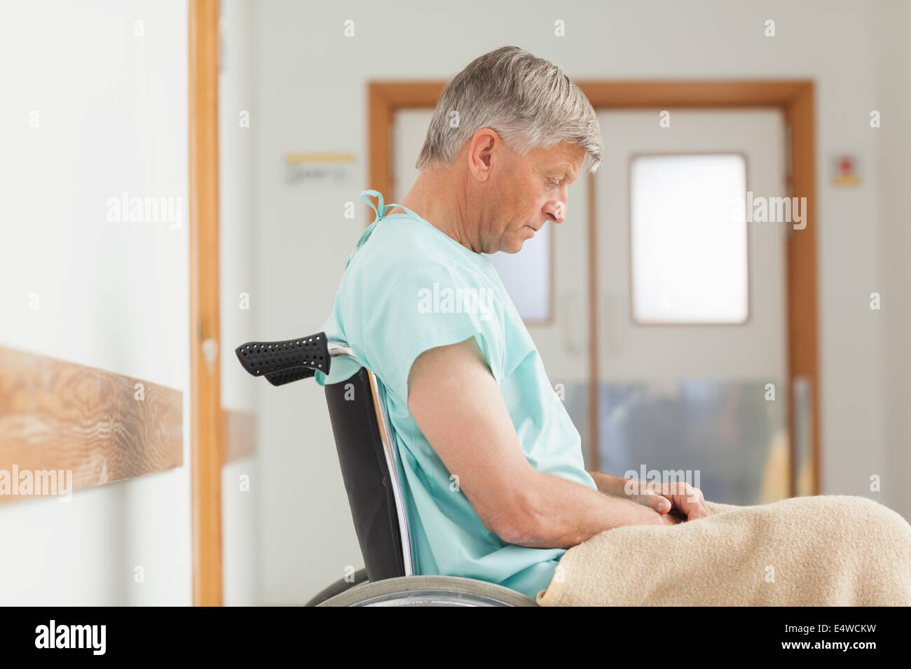 Man sitting in a wheelchair Stock Photo - Alamy