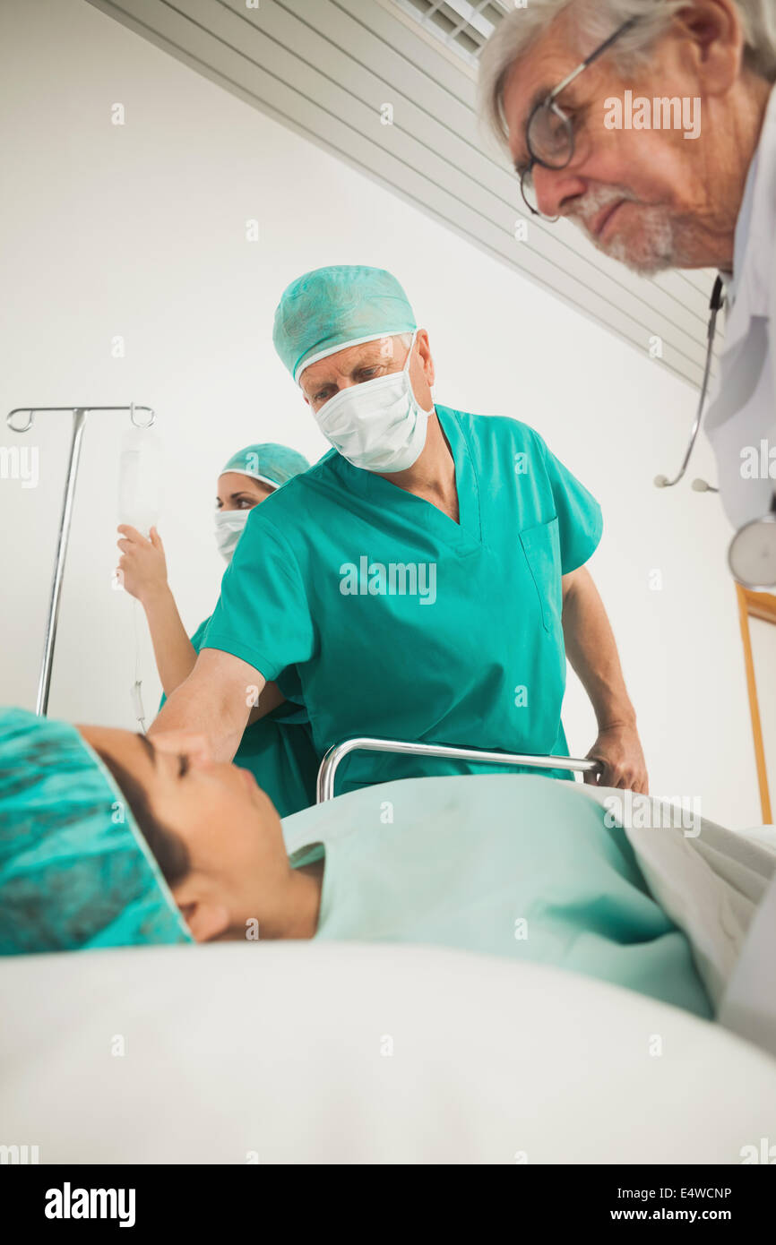 Doctor looking at a female patient Stock Photo - Alamy