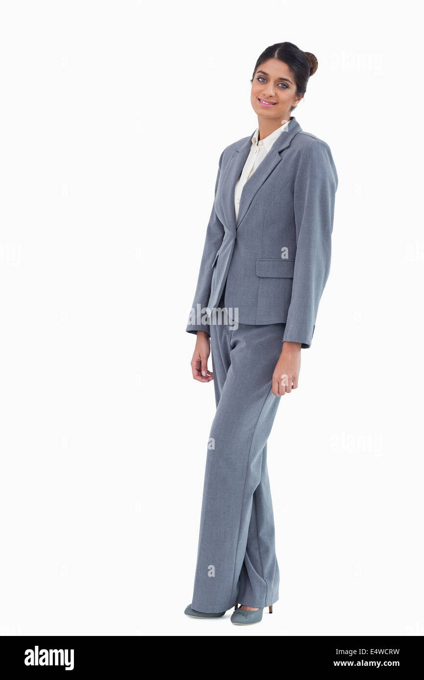 Smiling saleswoman standing Stock Photo - Alamy