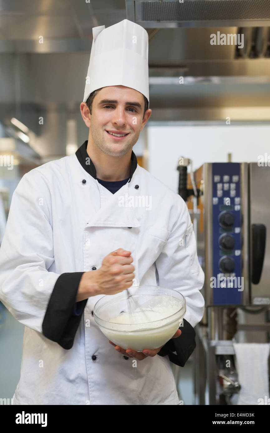 Cheerful man mixing batter Stock Photo - Alamy Cheerful man mixing batter Stock Photo - Alamy
